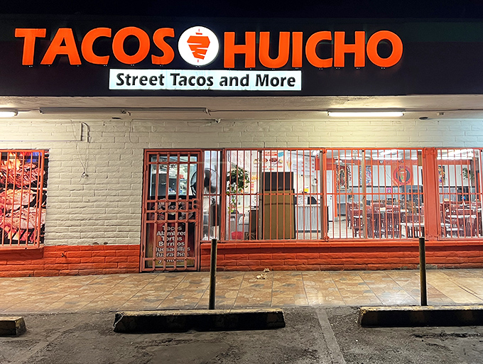 Tacos Huicho's nighttime glow acts like a beacon for taco lovers. Those red security bars can't contain the amazing aromas wafting from inside.
