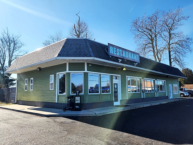 The Backyard's green exterior hints at the fresh ingredients waiting inside. Neighborhood joint, destination-worthy burgers!
