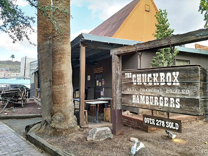 Part rustic cabin, part burger institution. That wooden sign promising "OVER 278 SOLD" might be the understatement of the century.