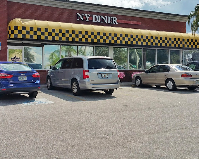 The New York Diner brings Big Apple energy to Valrico with its classic brick exterior and checkered yellow awning.