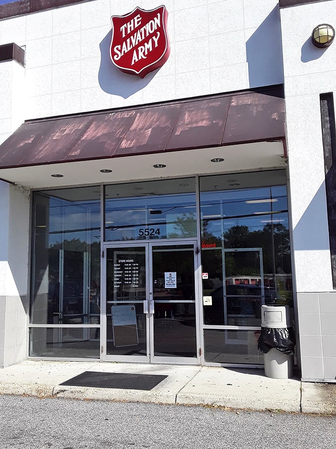 The iconic red shield of Salvation Army stands guard over a warehouse of wonderful deals and second chances.