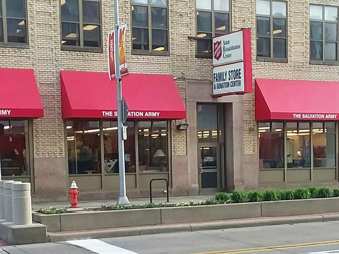 The Salvation Army's classic brick building with cherry-red awnings promises both retail therapy and community support.