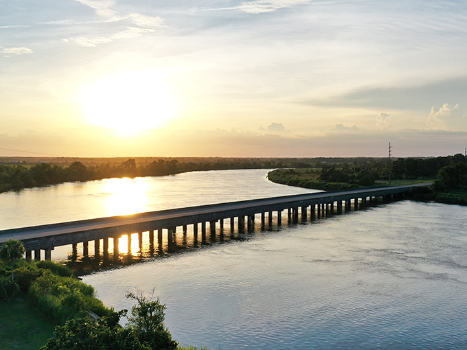 Golden hour magic on the Altamaha Scenic Byway. This bridge carries you between worlds as the sun bids farewell.