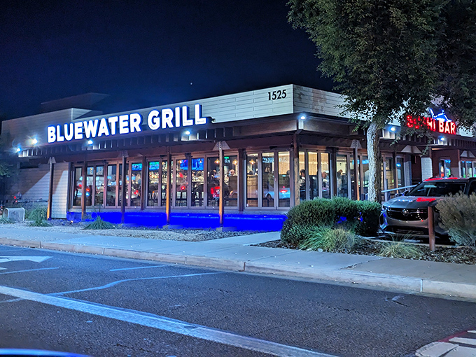 Bluewater Grill lights up the night with its welcoming blue glow. Evening dining here feels like a seaside escape in the heart of Phoenix.
