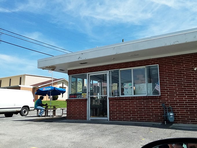 Sunshine bounces off this humble building where hot dog magic happens daily. Remember to ask for extra napkins!