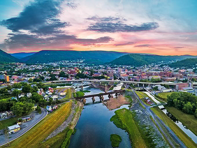 The sunset over Cumberland's bridges creates the kind of view that makes you forget to check your phone for hours.