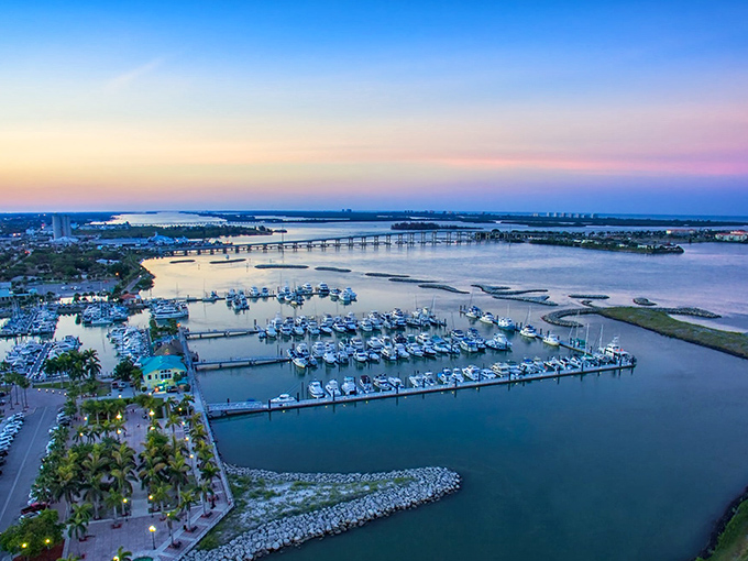 Twilight transforms the waterfront into a painting. Local restaurants light up as fishing boats return with the day's catch.