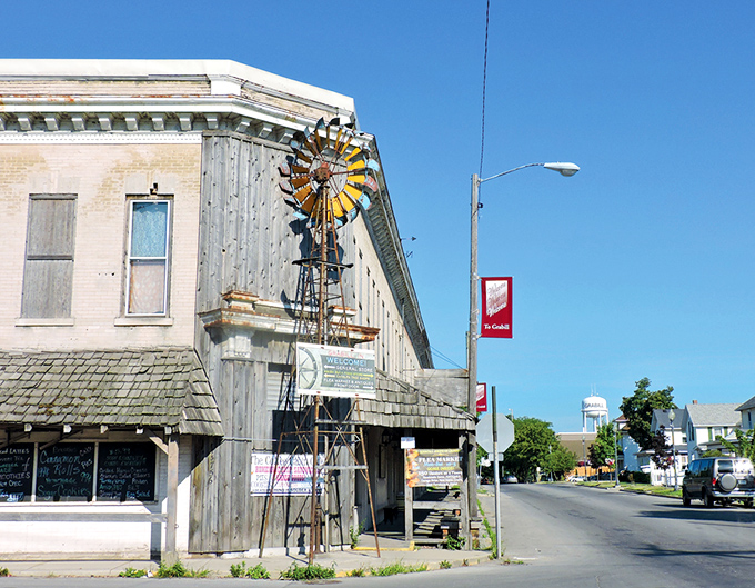 That vintage windmill stands sentinel over Grabill's weathered storefronts. A perfect symbol of the town's blend of practicality and preservation.