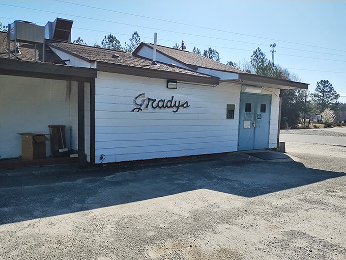 The modest side entrance to Grady's doesn't hint at the magic happening inside. Great barbecue doesn't need fancy packaging—just wood, smoke, and time.