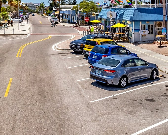 Gulfport's vibrant streets buzz with life, where colorful storefronts, cyclists, and friendly locals create the perfect setting for an affordable coastal lifestyle.