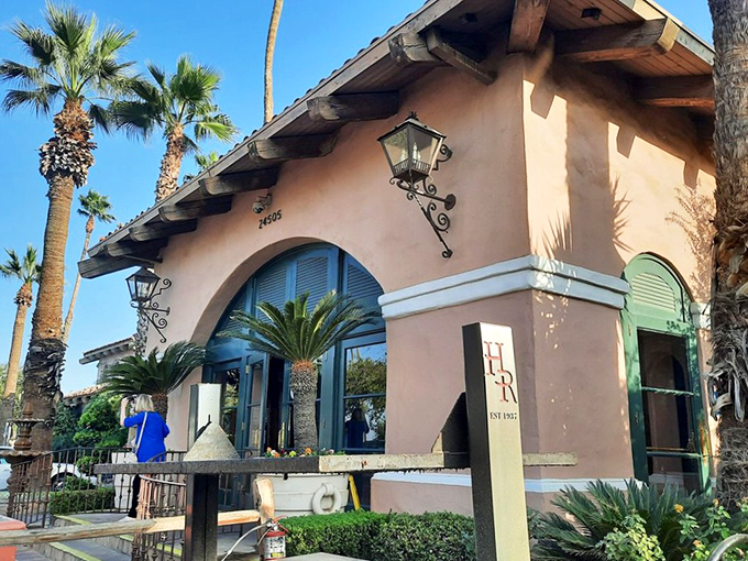 Palm trees frame Harris Ranch's mission-style entrance. Inside awaits the freshest farm-to-table beef experience that California's agricultural heartland can offer.