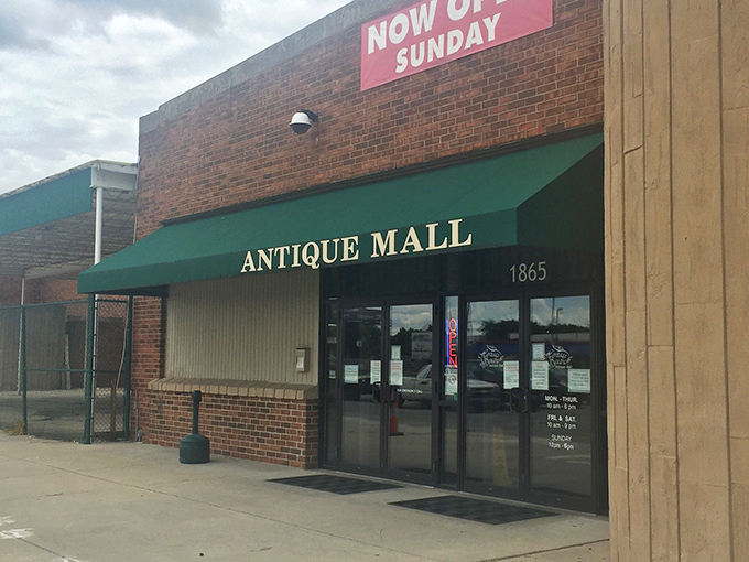 "Now Open Sunday" &ndash; Heritage Square tempts weekend treasure hunters with its green awning and promise of discoveries.