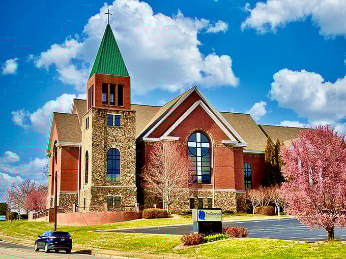 The Heart of the Community – McConnell Memorial Baptist Church stands tall in Hiawassee, offering a place of worship and connection with stunning architecture against a mountain sky.