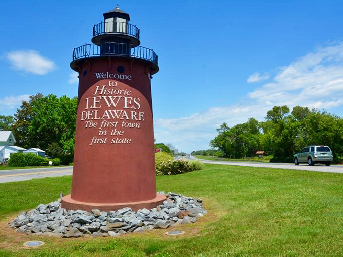 Lewes' lighthouse-shaped welcome sign stands proud against blue skies. Like a maritime version of Hollywood's famous landmark, just smaller and saltier.