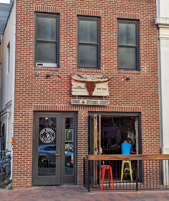 Jack Brown's brick fa&ccedil;ade and open-air window create the perfect burger joint vibe. Where conversations flow as freely as the craft beer.