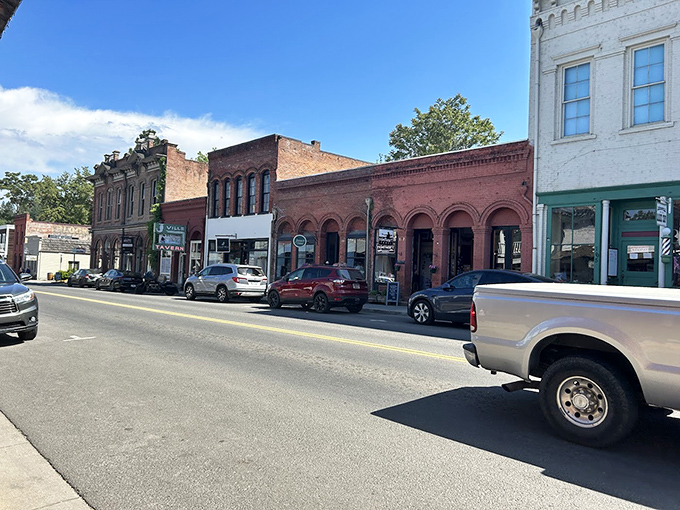 Preserved storefronts from another era line streets where modern shoppers hunt for treasures of a different kind.