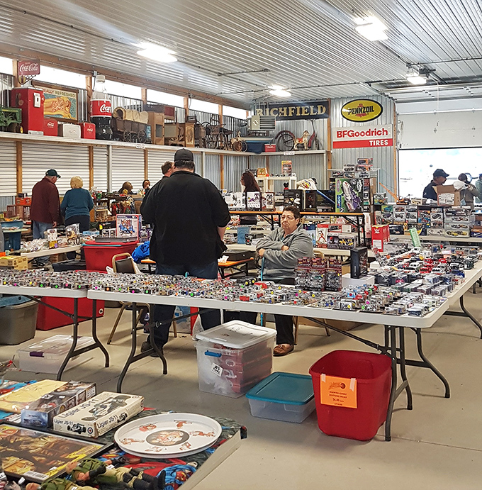 Patriotic displays and nautical treasures at Jake's outdoor market. Every table tells a different collector's story.