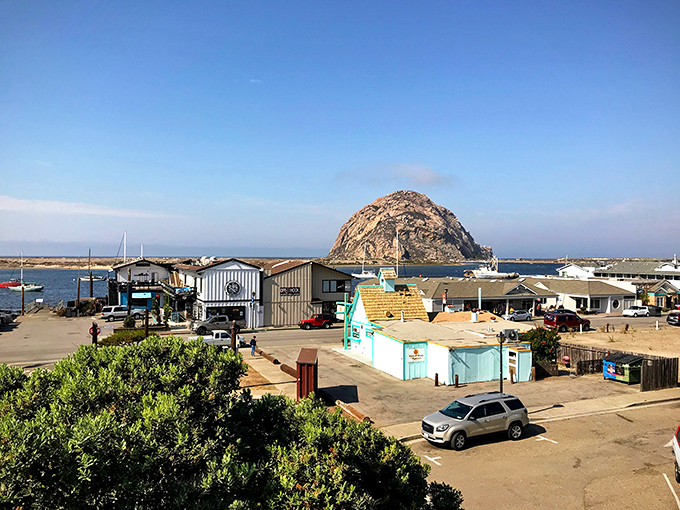 The working waterfront where fishing shacks and turquoise buildings prove beauty doesn't need to wear fancy clothes to impress.