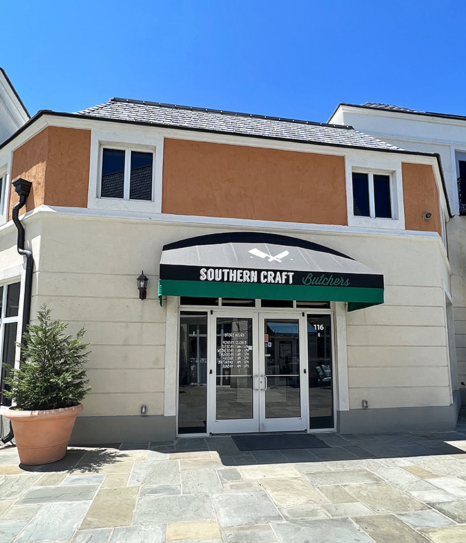 That green awning shelters sandwich artistry where pimento cheese gets the respect it deserves.