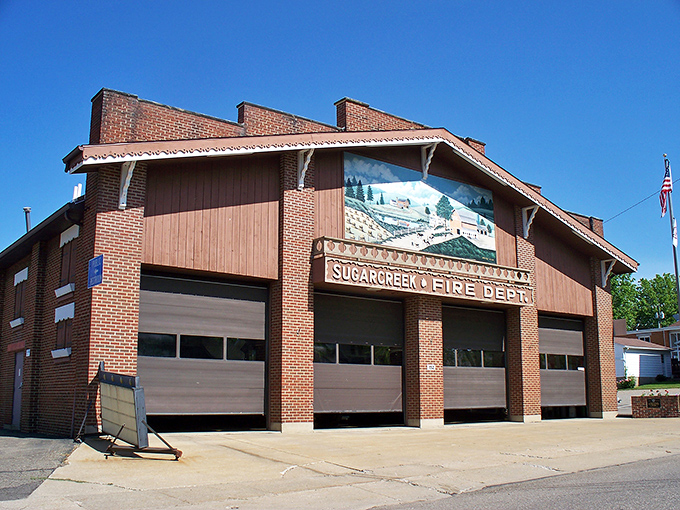 The Sugarcreek Fire Department building showcases local pride with its charming winter mural and distinctive Swiss-inspired architecture.
