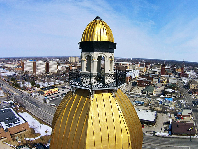This golden dome catches sunlight like a beacon, proving that even modest cities can have magnificent landmarks.