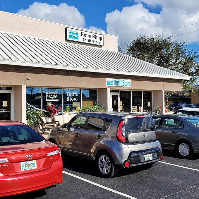 Wicker chairs outside hint at the home goods treasures within. A thrift porch that says "come sit and stay awhile!"