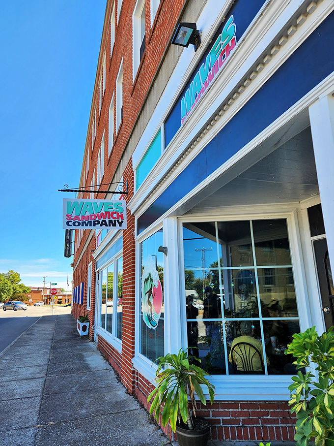 Bright storefront, brighter flavors—Waves brings coastal sandwich energy to historic brick surroundings. A delicious contradiction worth experiencing.