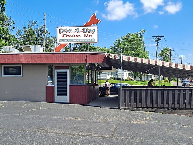 That classic arrow sign points the way to hot dog heaven &ndash; no GPS required, just follow your nose and the crowd.