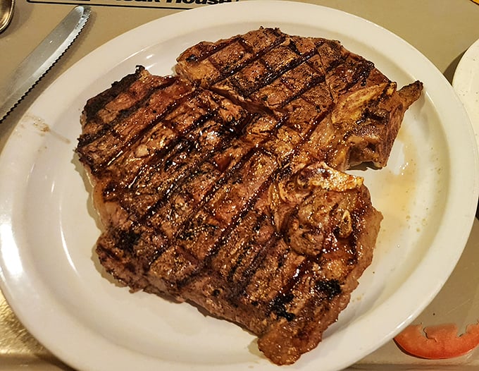This T-bone isn't just a steak&mdash;it's a declaration of carnivorous intent, with grill marks so perfect they could win a geometry competition.