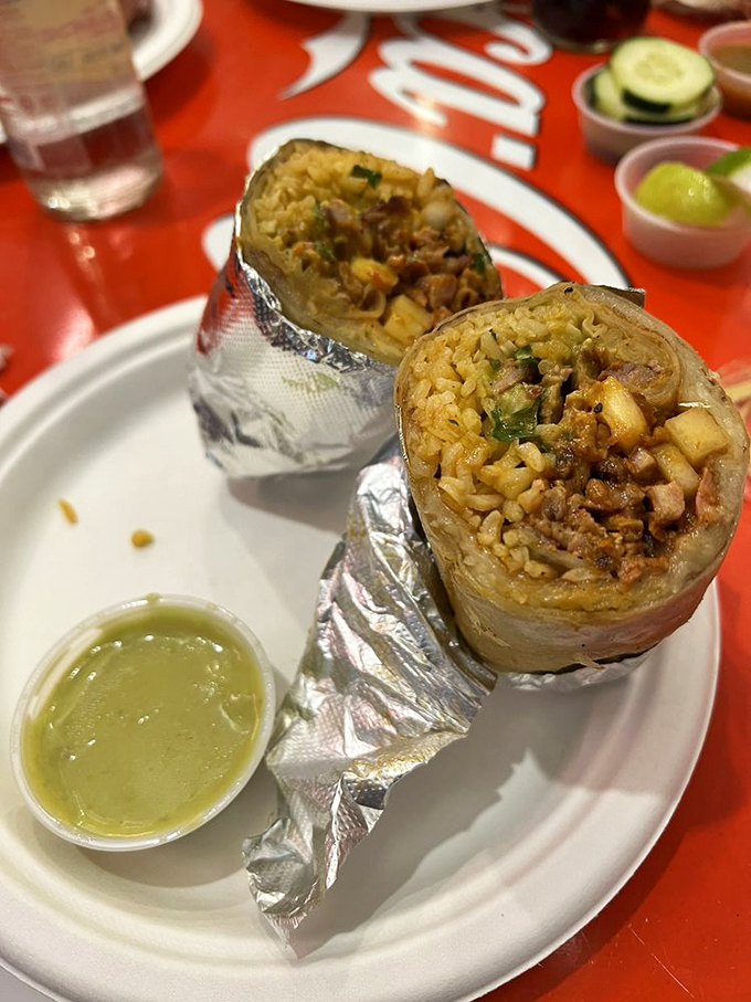 Al pastor burrito wrapped tight, ready to deliver flavors that'll make you smile.