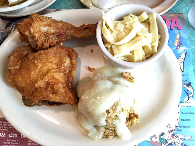 Comfort on a plate: fried chicken, mashed potatoes with gravy, and homemade noodles. The holy trinity of "I might need a nap after this" deliciousness. 