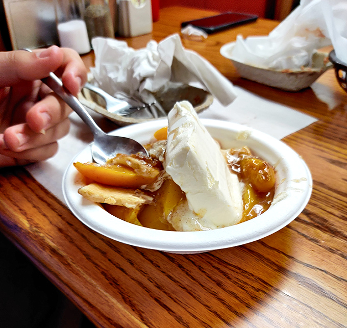 Peach cobbler meets ice cream in a summer romance that would make Nicholas Sparks weep. The warm-cold contrast is practically poetry.