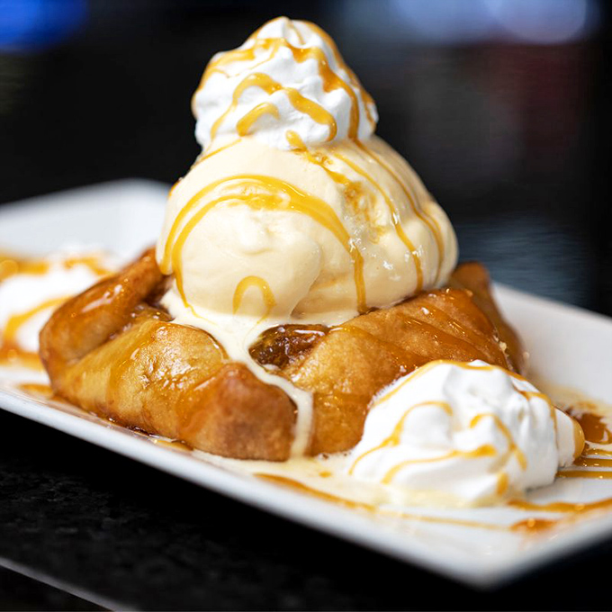 Sopapillas that would make angels weep, topped with ice cream melting into warm, honey-drizzled pastry. Dessert nirvana has been achieved. 