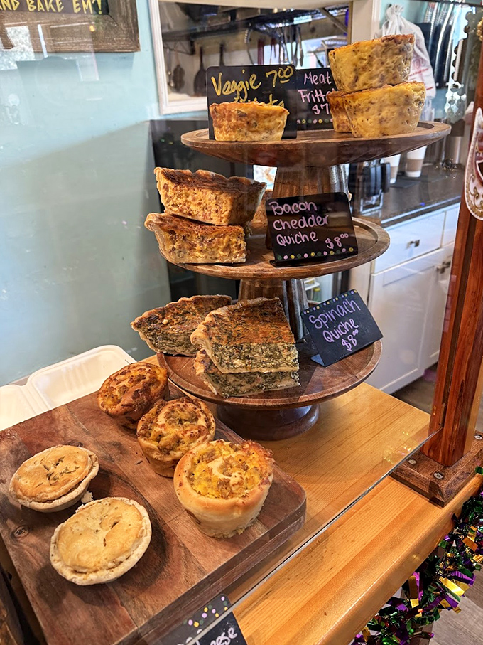 A three-tiered display of quiche perfection&mdash;each slice promising a different adventure in flavor country.