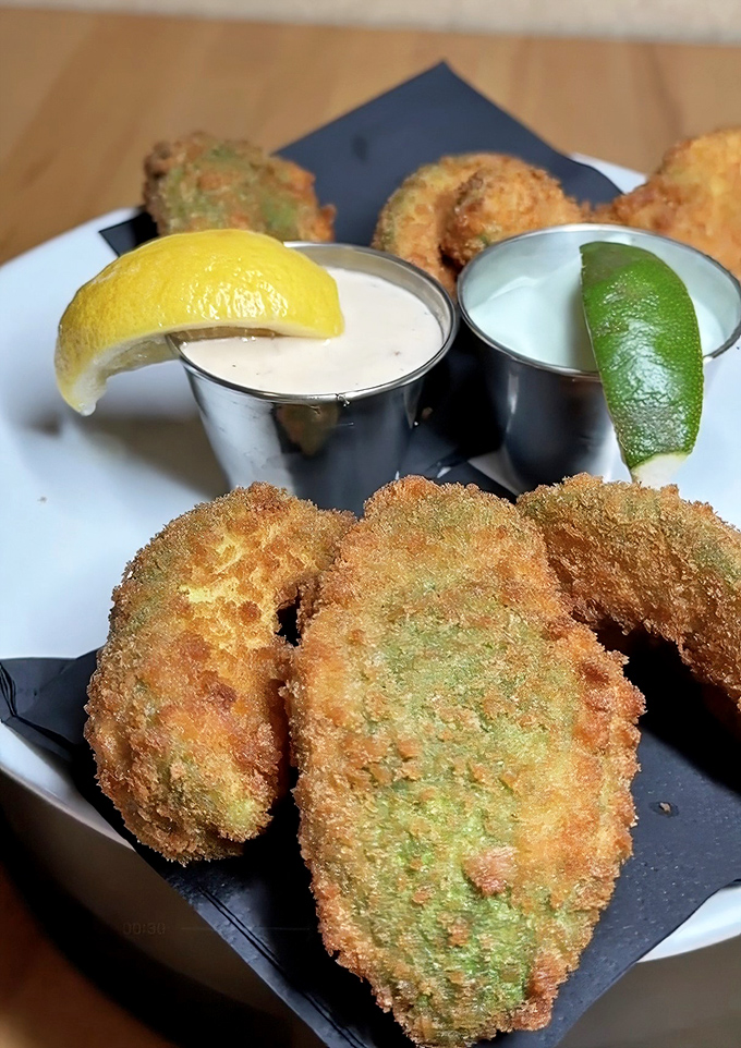 Golden-fried avocado perfection arrives with creamy dipping sauces that'll make you question everything about appetizers.