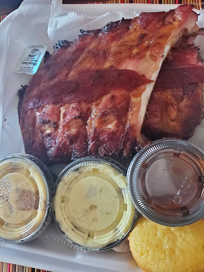 These ribs have the kind of bark that doesn't bite—unless you count the way they lovingly nip at your taste buds with smoky perfection.