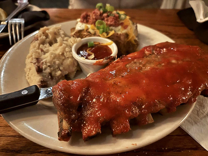 These ribs aren't falling off the bone&mdash;they're voluntarily leaping into flavor paradise alongside mashed potatoes and a loaded baked potato.