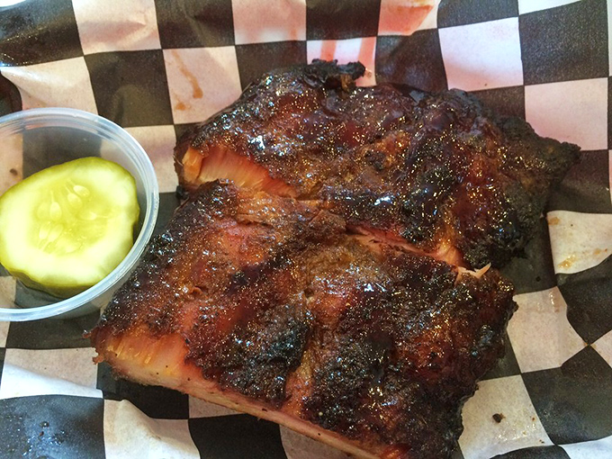 That bark! Those ribs have clearly been introduced to smoke and spice in a long, slow dance that ends in fall-off-the-bone perfection.