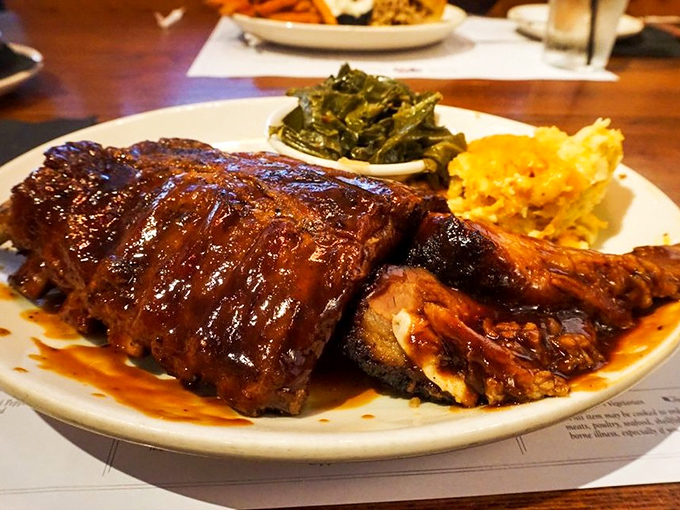 These ribs don't just fall off the bone—they practically leap onto your fork. The glossy sauce catches light like stained glass in a barbecue cathedral.