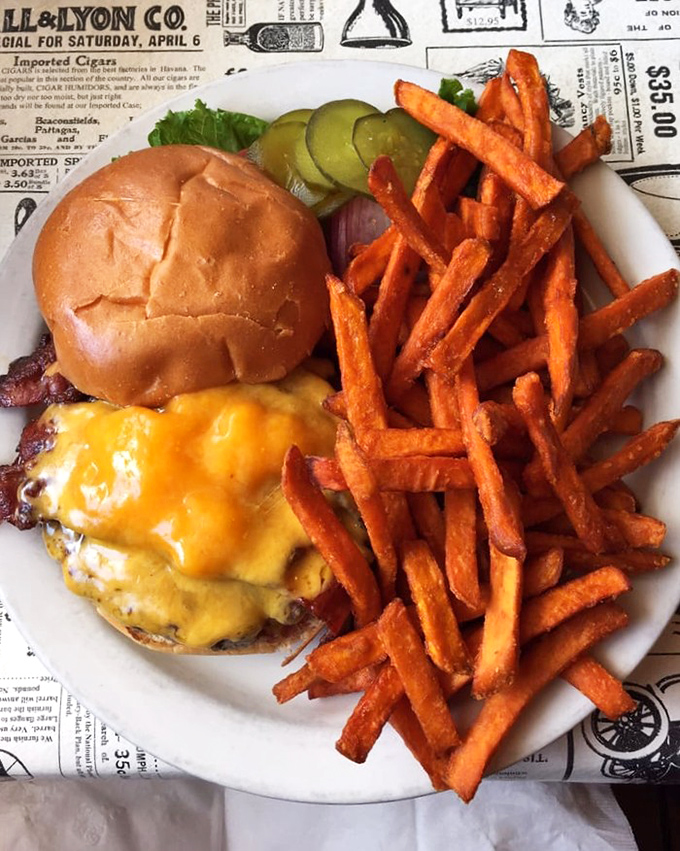This isn't just a cheeseburger&mdash;it's a masterclass in American classics. Melty cheese, perfectly charred patty, and sweet potato fries that'll make you forget regular potatoes exist.