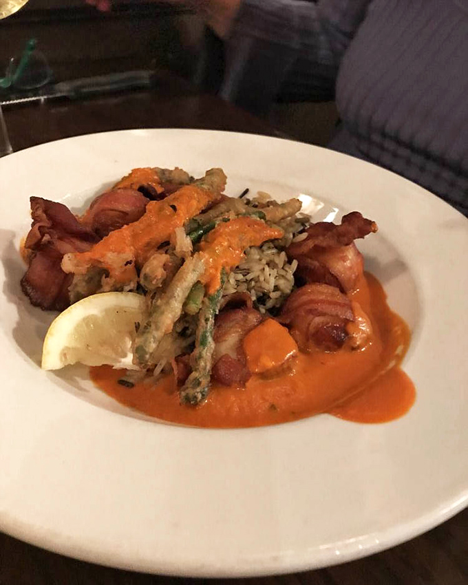 Seafood and bacon – a marriage so perfect it deserves its own reality show. These crispy, savory bites are served with a sauce worth bottling.