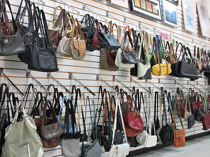 Handbag heaven! Designer lookalikes mingle with genuine vintage finds in this wall-to-wall display of practical fashion statements.