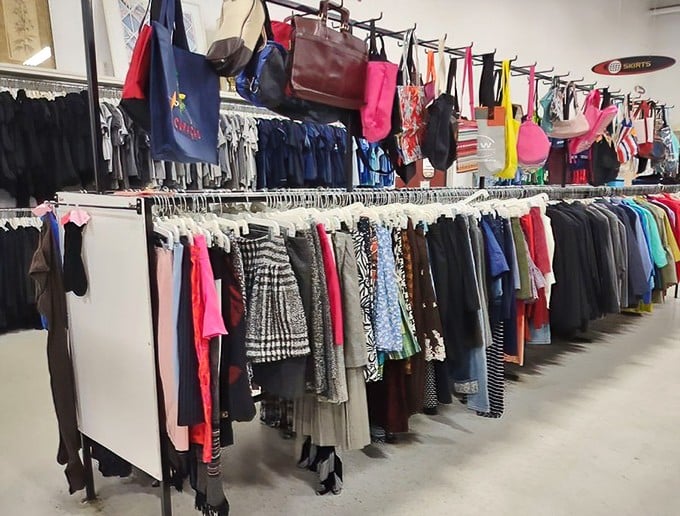 Handbags dangle like colorful fruit above a garden of skirts and dresses. Fashion archaeology at its finest&mdash;dig in and unearth your style.