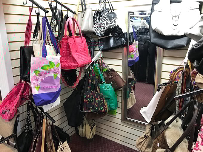 Handbag heaven! From practical totes to statement purses, this wall of accessories proves that yesterday's fashion castoffs are today's vintage finds.