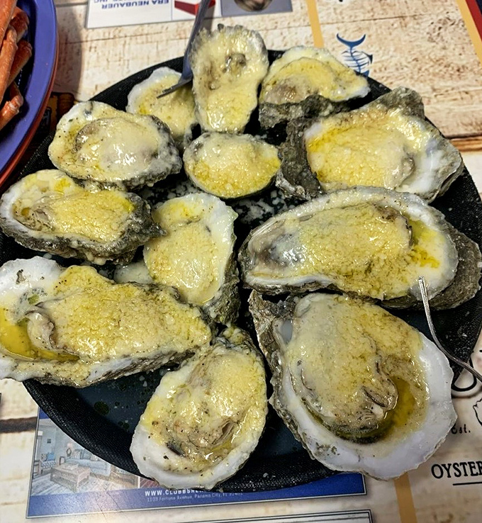These baked oysters aren't just appetizers; they're little boats of joy sailing on waves of melted butter and cheese. Napkins required, restraint optional.