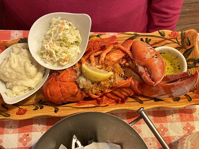 The holy grail of lobster dishes arrives on a wooden plank like Neptune's personal offering. Sides of coleslaw and mashed potatoes know their place.