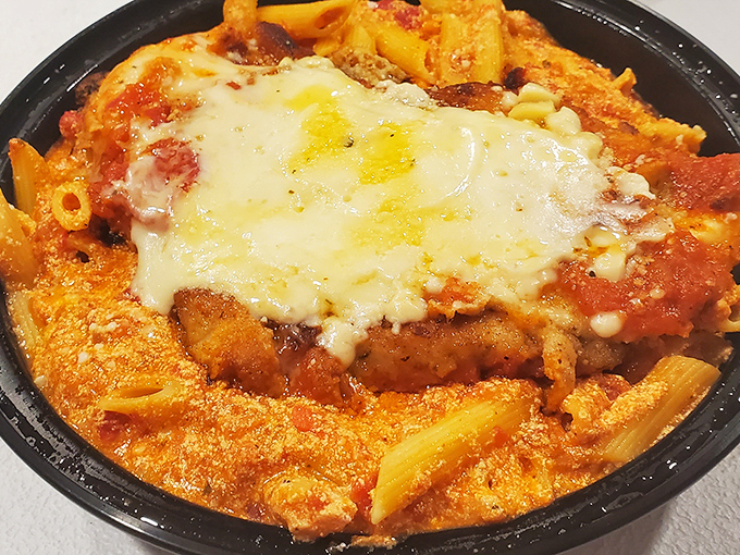 This isn't just pasta – it's a warm hug in food form, with cheese melted over homemade cutlets and penne that's absorbed all the goodness of that robust sauce.