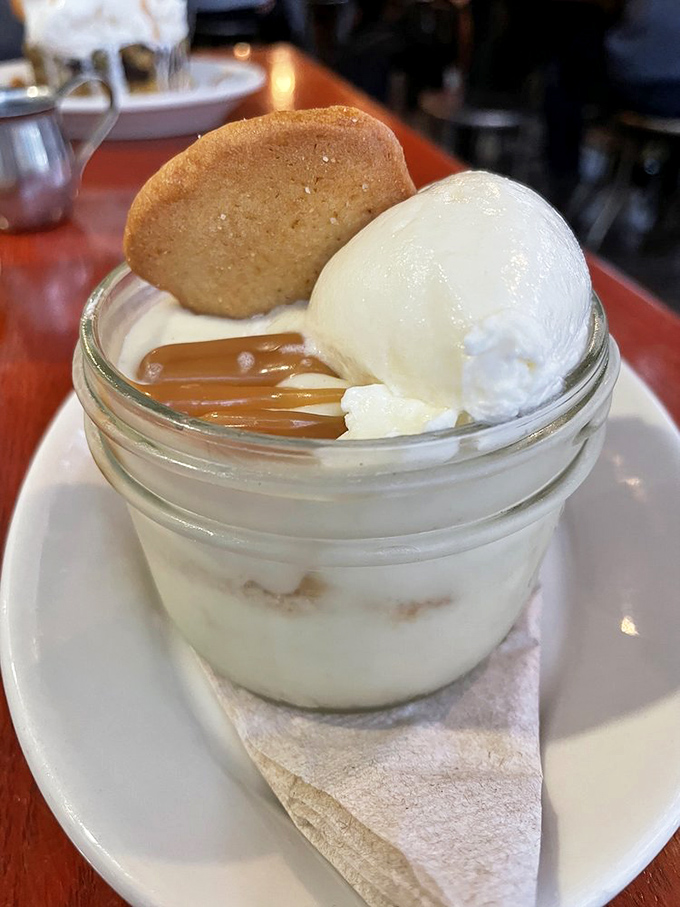Banana pudding that would make your grandmother both proud and jealous, topped with a drizzle of caramel that's pure Southern poetry.
