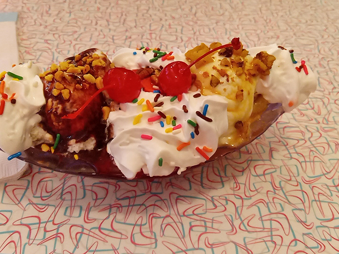 This banana split isn't just dessert&mdash;it's a carnival of joy with whipped cream mountains and sprinkle confetti. Calories don't count when something looks this festive.