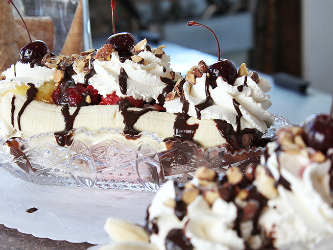 Banana splits here aren't just desserts&mdash;they're architectural achievements. That crystal dish elevates this from snack to celebration in one glistening presentation.